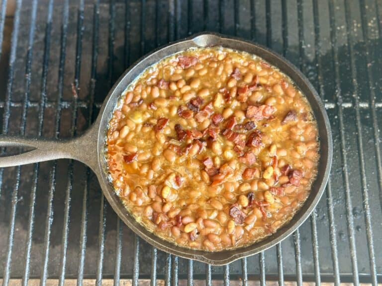 Easy Traeger Smoked Baked Beans Recipe with Bacon • Fancy Apron
